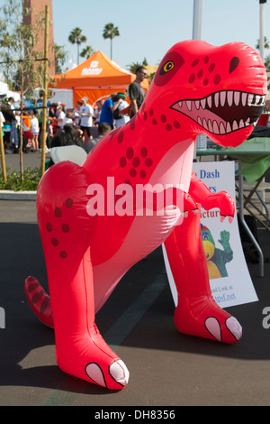 An Inflatable red dinosaur at the Tustin Dino dash in Southern ...
