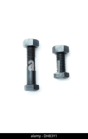 Pair of stainless nuts and bolts on metallic background construction ...