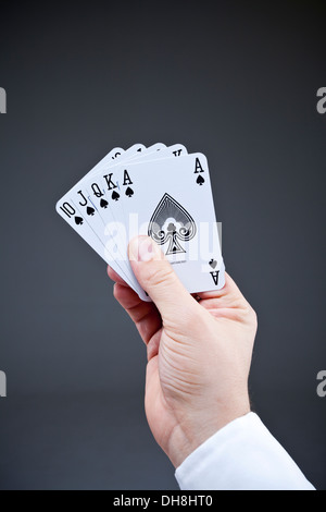 Playing cards being held in mans hand Stock Photo - Alamy