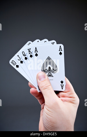 Playing cards being held in mans hand Stock Photo - Alamy
