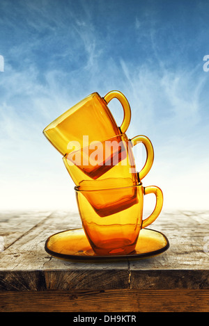 The empty glass cups on a wooden table Stock Photo - Alamy