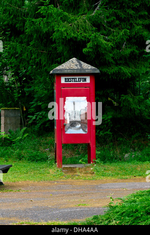 Swedish old-fashioned phone booth with painting on the door Stock Photo ...