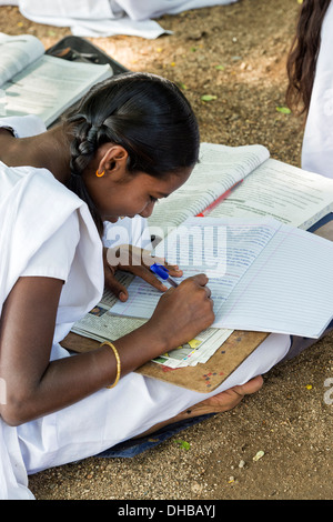 Indian School Girl Student Writing Note Book Studying In Class Stock ...