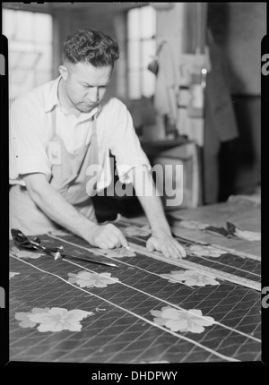 The photograph captures the upholstery process at the Tomlinson Chair ...