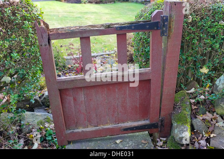 Badly rotted garden gate, falling off its hinges Stock Photo - Alamy