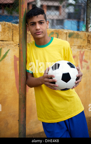 Portrait of Football player holding ball Stock Photo - Alamy