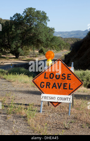 Loose Gravel warning sign on rural road - California, USA Stock Photo ...