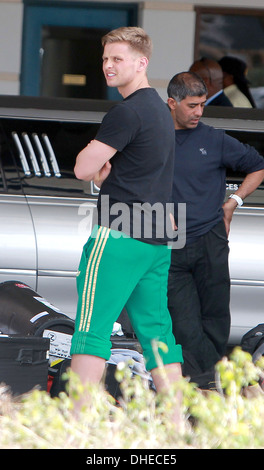 Jeff Brazier takes a walk along a beach and prepares to go for a swim ...