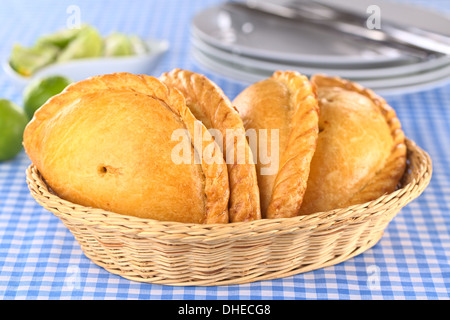 Peruvian snacks called Empanadas (pies) filled with chicken and beef in ...