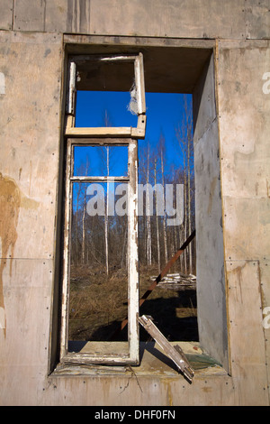 Exterior of an abandoned apartment buildings with broken windows in a ...