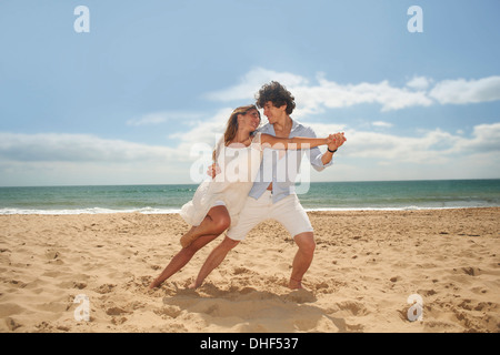 Couple tangoing on beach Stock Photo - Alamy