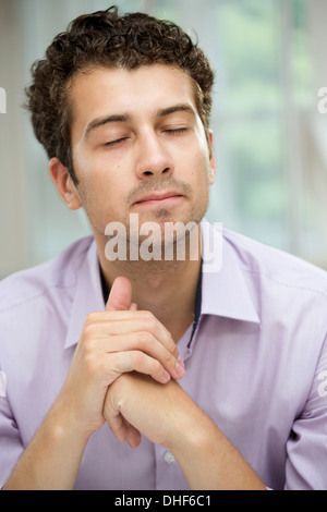 Man in deep thought on balcony Stock Photo - Alamy