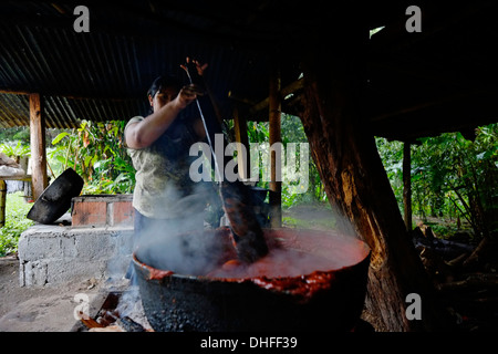 A Panamanian villager makes a marmalade made of Guava in Boquete ...