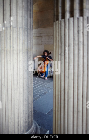 Cello playing busker in Paris, France Stock Photo - Alamy