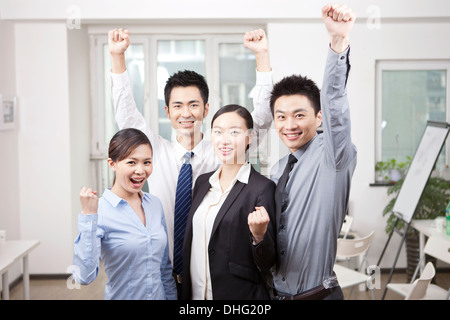 Group of young business people cheering Stock Photo - Alamy