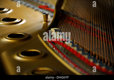 inside the piano: string, pins, keys and hammers Stock Photo - Alamy