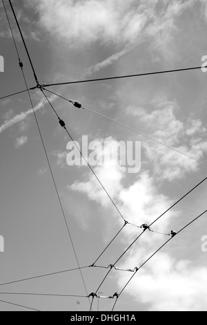 Overhead electric cables for tram line against blue sky, Edinburgh ...