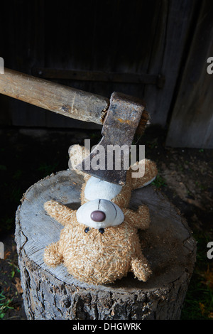 Execution of child toy teddy bear with an ax Stock Photo - Alamy