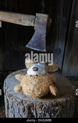 Execution of child toy teddy bear with an ax Stock Photo - Alamy