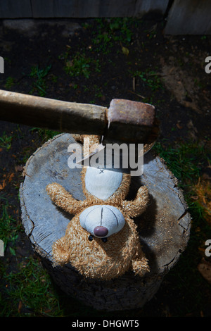 Execution of child toy teddy bear with an ax Stock Photo - Alamy