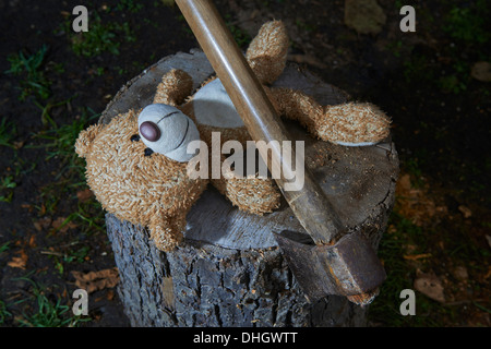 Execution of child toy teddy bear with an ax Stock Photo - Alamy