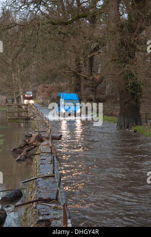 Van driving through flood Stock Photo - Alamy