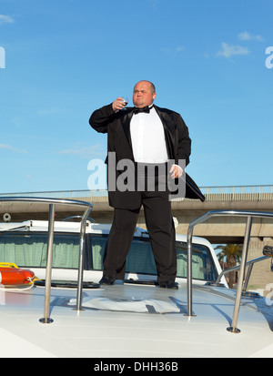 Fat man in tuxedo with glass wine Stock Photo - Alamy