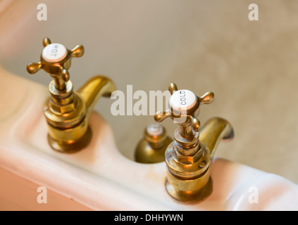 Old brass taps Stock Photo - Alamy