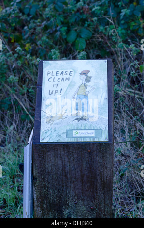 Sign asking dog owners to clean up after their pet Stock Photo - Alamy