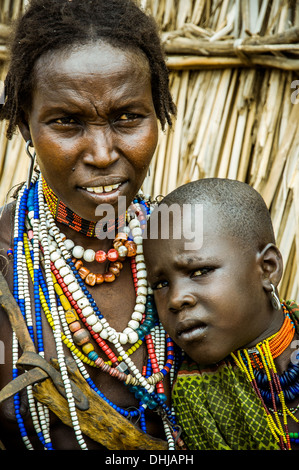 A member of the tribe poses to be taken a picture in Omo Valley ...
