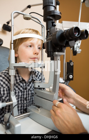 A man having an eye test with Slit Lamp / female doctor in ...