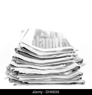 Closeup of newspapers on plain background Stock Photo - Alamy