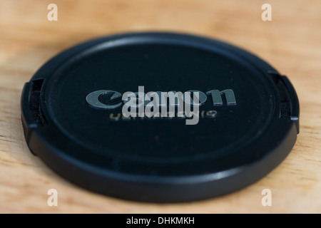 Black camera lens cap on dark texture background with copy space for text Stock Photo - Alamy