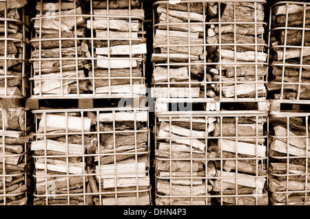 Firewood stacked in Grid boxes in black and white Stock Photo - Alamy