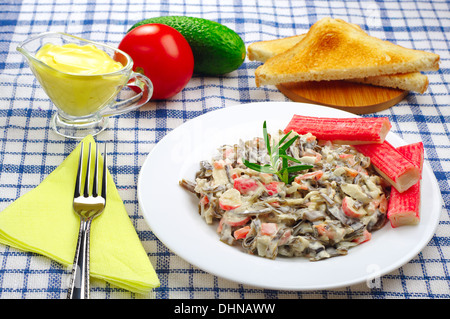 Salad with crab sticks on blue wooden background Stock Photo - Alamy