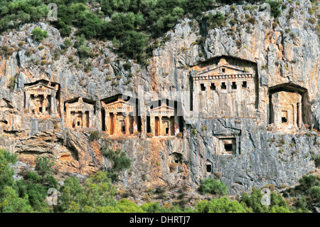 Ancient rock tombs of the Lycian Kings cut into the rock face above ...