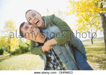 Man giving piggyback ride to his wife and smiling, Biltmore Hotel ...