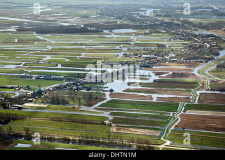 Netherlands, Den Ilp, Houses and farms in polder landscape. Aerial ...