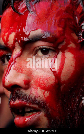 Blood runs down on the face of a Shiite Muslim during a Muharram ...