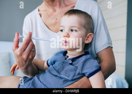 CHILD TAKING MEDICATION Stock Photo - Alamy