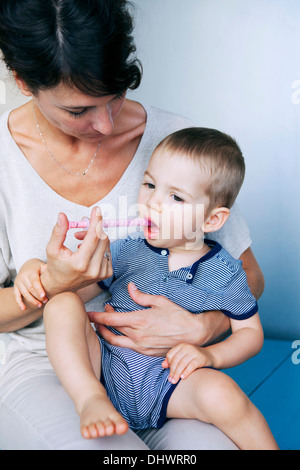 CHILD TAKING MEDICATION Stock Photo - Alamy