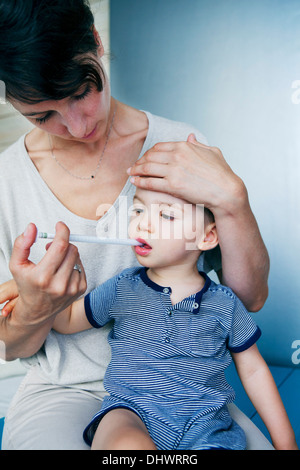 CHILD TAKING MEDICATION Stock Photo - Alamy