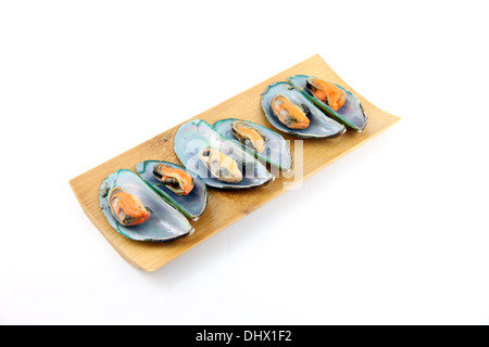 Mussel in bamboo dish on white background Stock Photo - Alamy