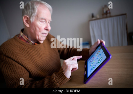 Elderly person with tablet Stock Photo - Alamy