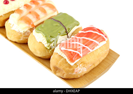 Donuts sort in the bamboo dish on white background Stock Photo - Alamy
