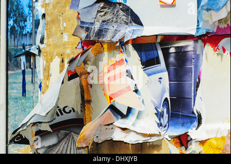 Torn billboard posters Stock Photo - Alamy