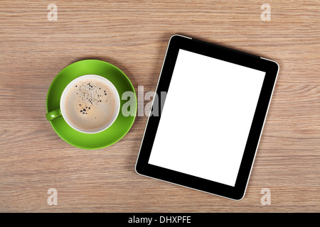 Tablet, blank sheet, glasses and coffee cup on office wooden table ...