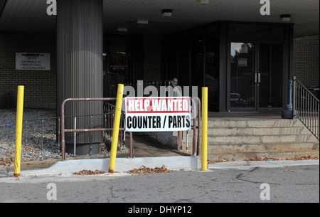 Help wanted sign in store window during summer in downtown Falmouth ...