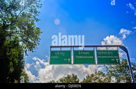 Road sign on the road to Thimphu, Bhutan against bright blue sky Stock ...