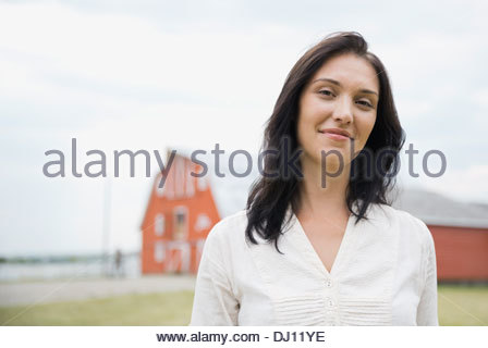 Woman standing outdoors Stock Photo - Alamy